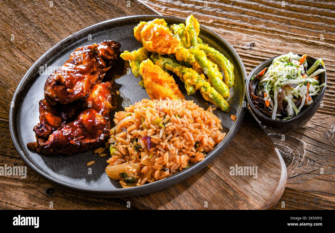 Chicken thighs in tamarind sauce with tom yum wok fried rice and ...