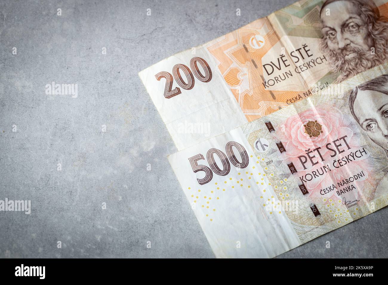 Banknotes of 200 and 500 Czech crowns on gray background, place for ...