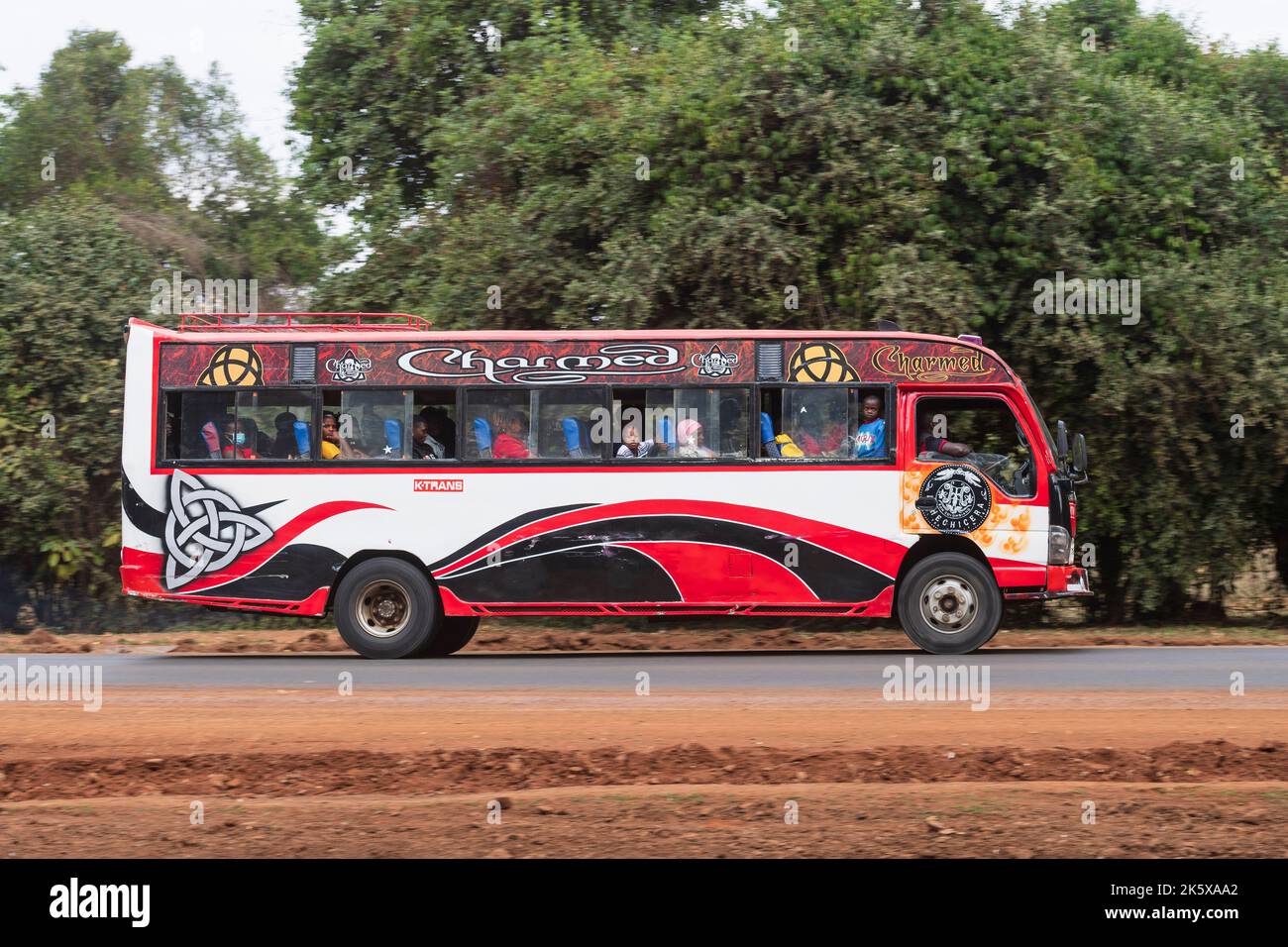 A bus with custom paintwork driving along Ngong road near the junction ...