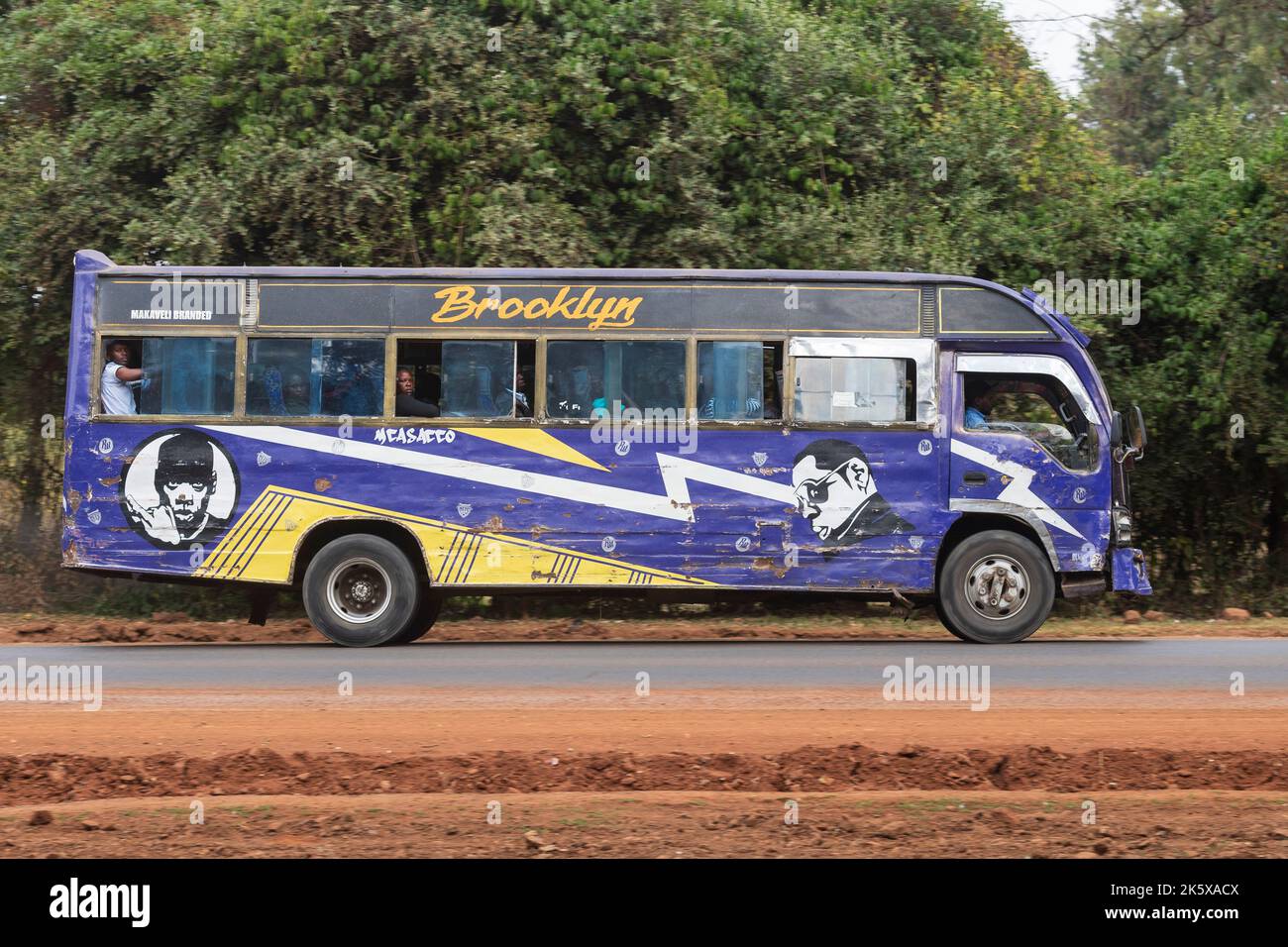 A bus with custom paintwork driving along Ngong road near the junction ...