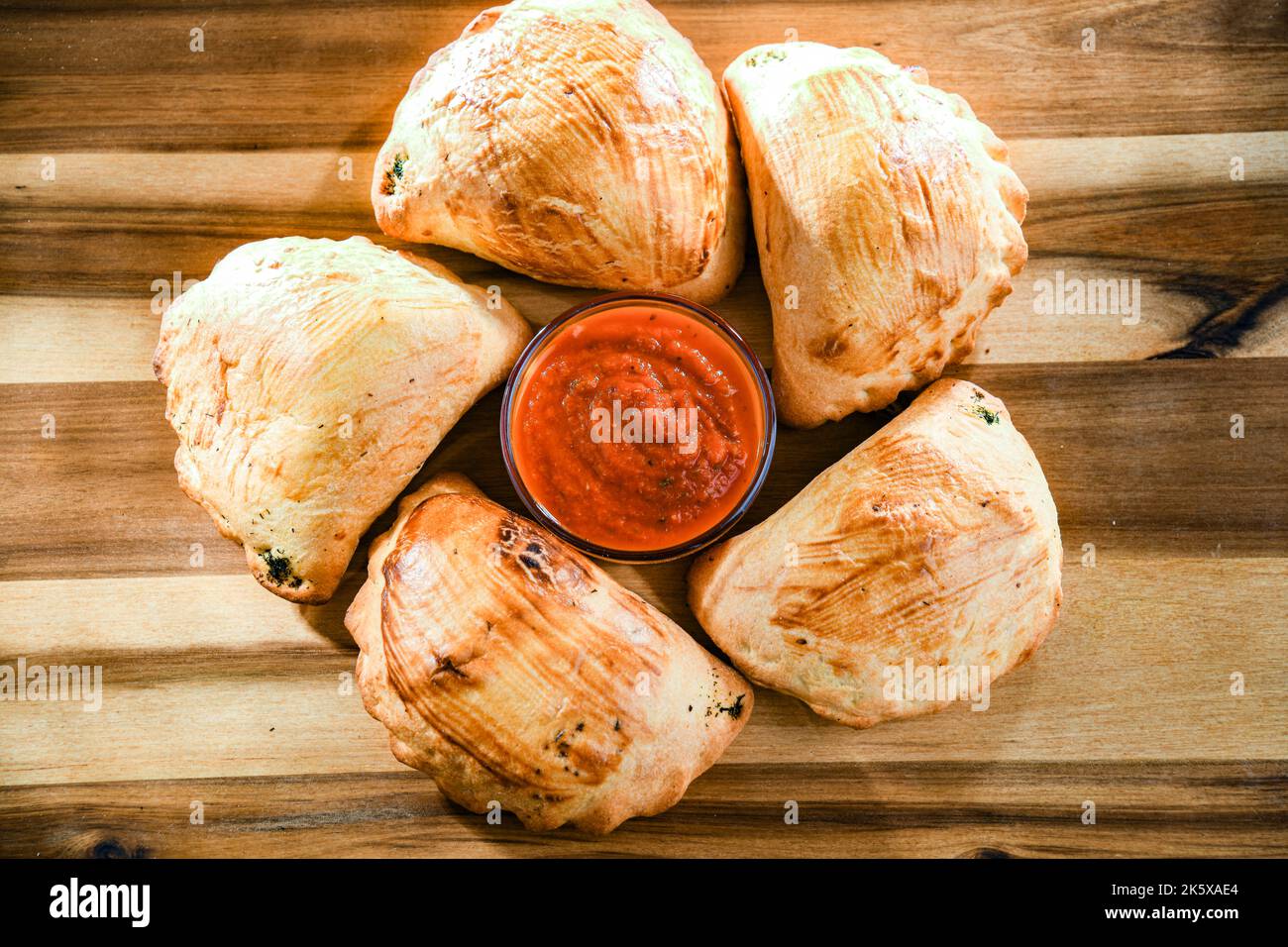 Composition with a dish of oven-baked pierogi Stock Photo - Alamy