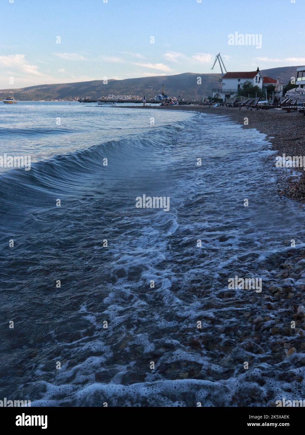 The beautiful wavy beach in the town of Bijela, Montenegro Stock Photo ...