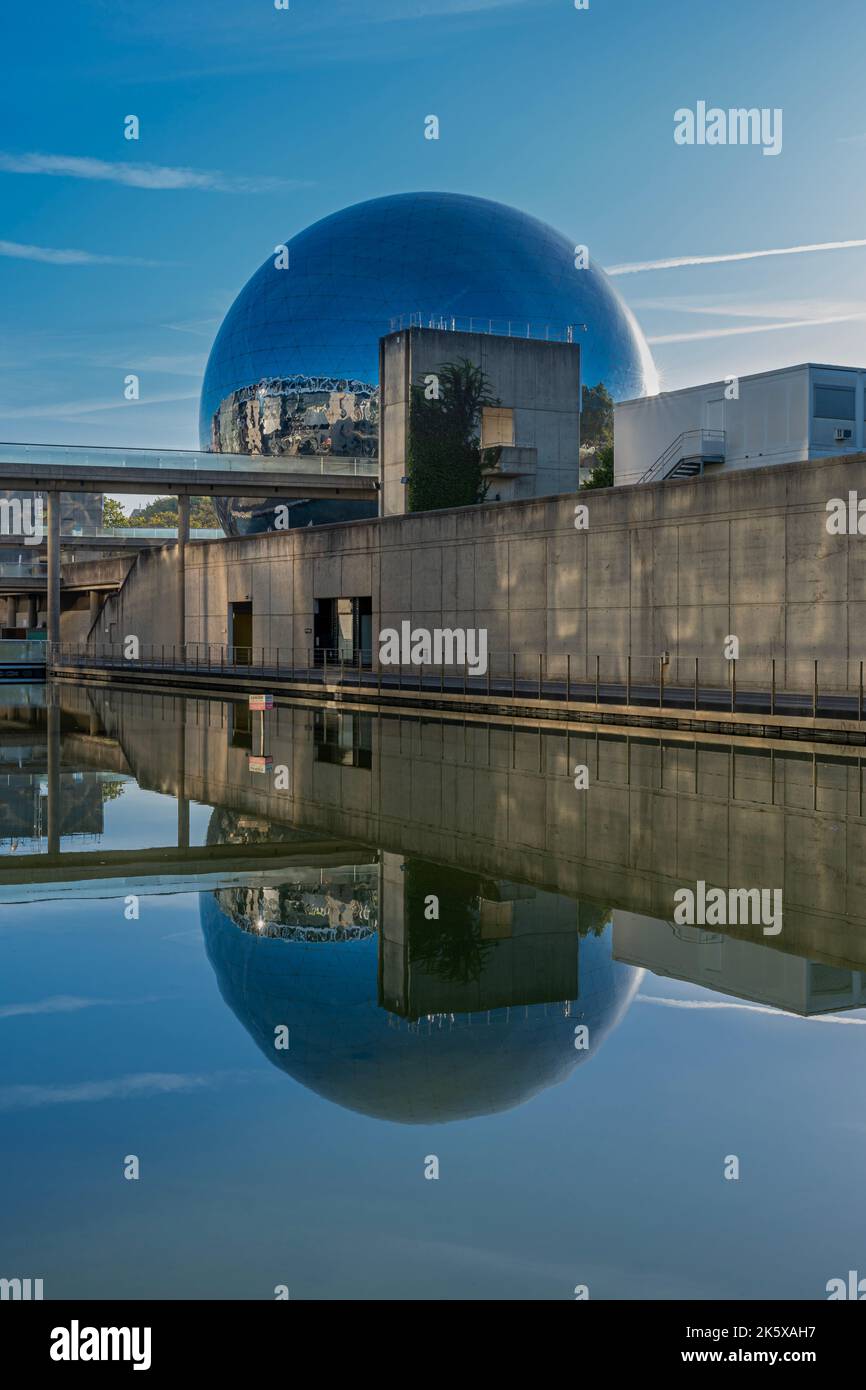 Villette Canal. View of La Geode and building of the Science and ...