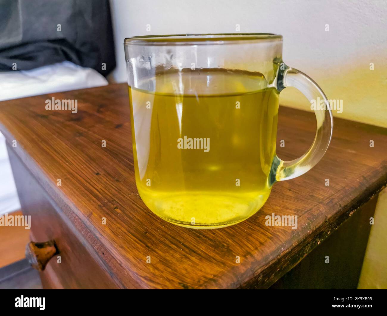 Glass or cup pot with hot ginger tea on a wooden table in Mexico Stock ...