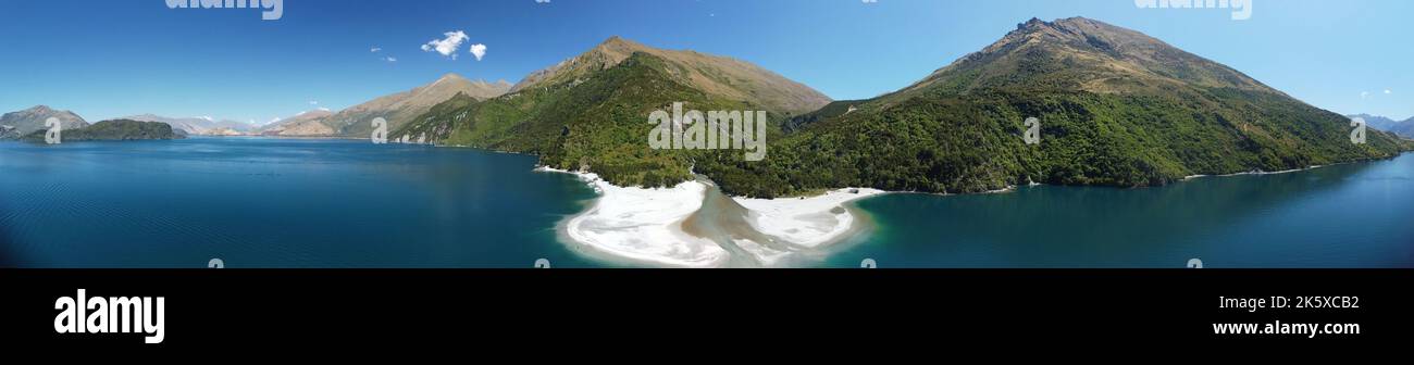 A panoramic view of Hawai island with a white seashore, green mountains ...