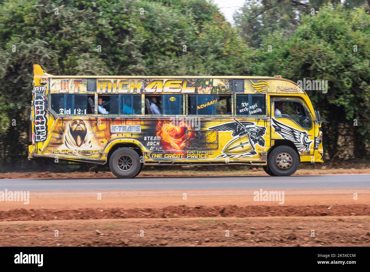 A bus with custom paintwork driving along Ngong road near the junction ...