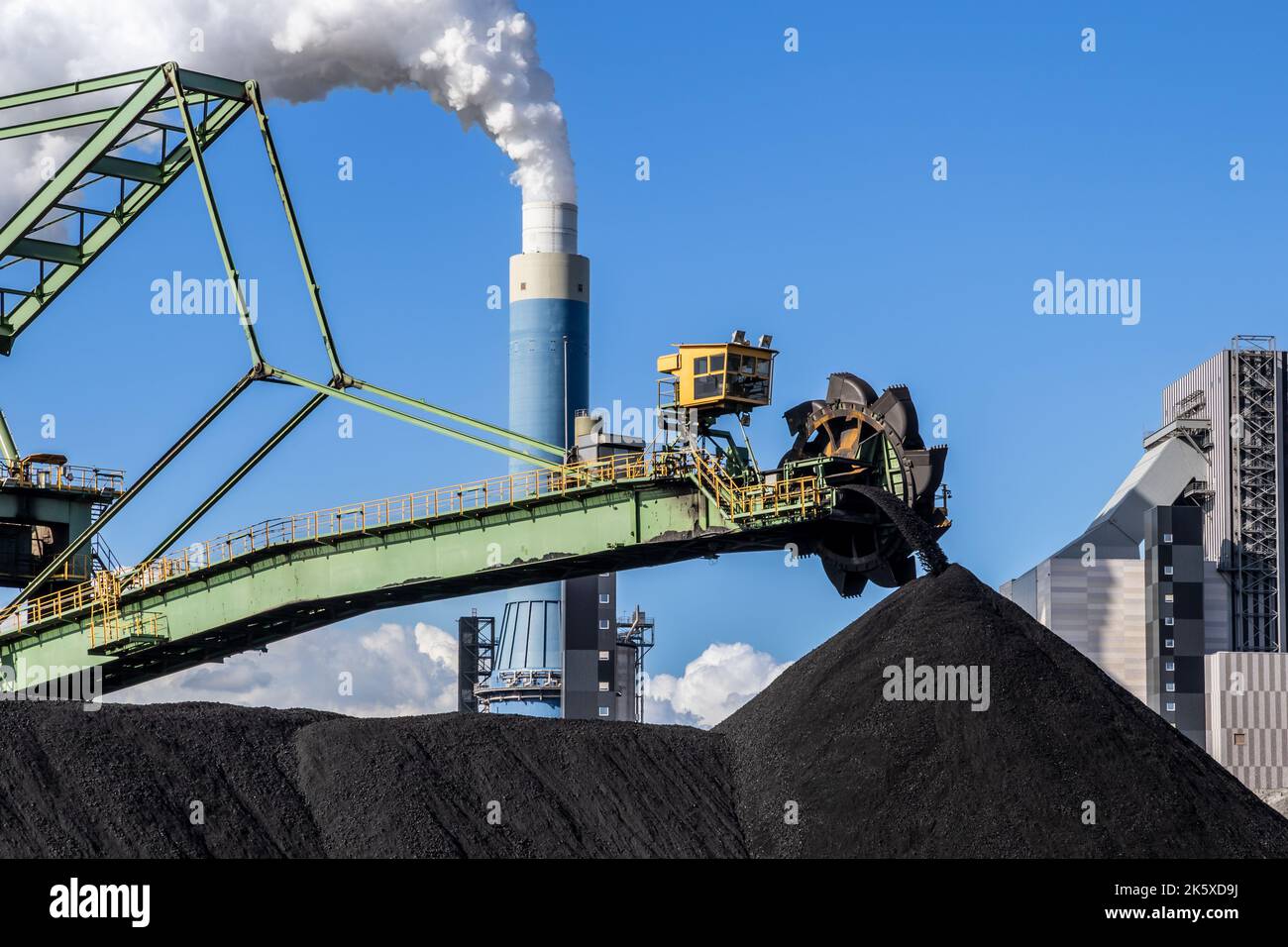 Stacker-reclaimer in a coal handling terminal with in the background a ...
