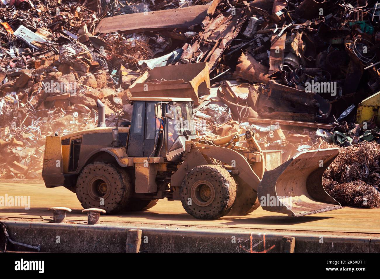 Bulldozer at a landfill with scrap metal Stock Photo - Alamy
