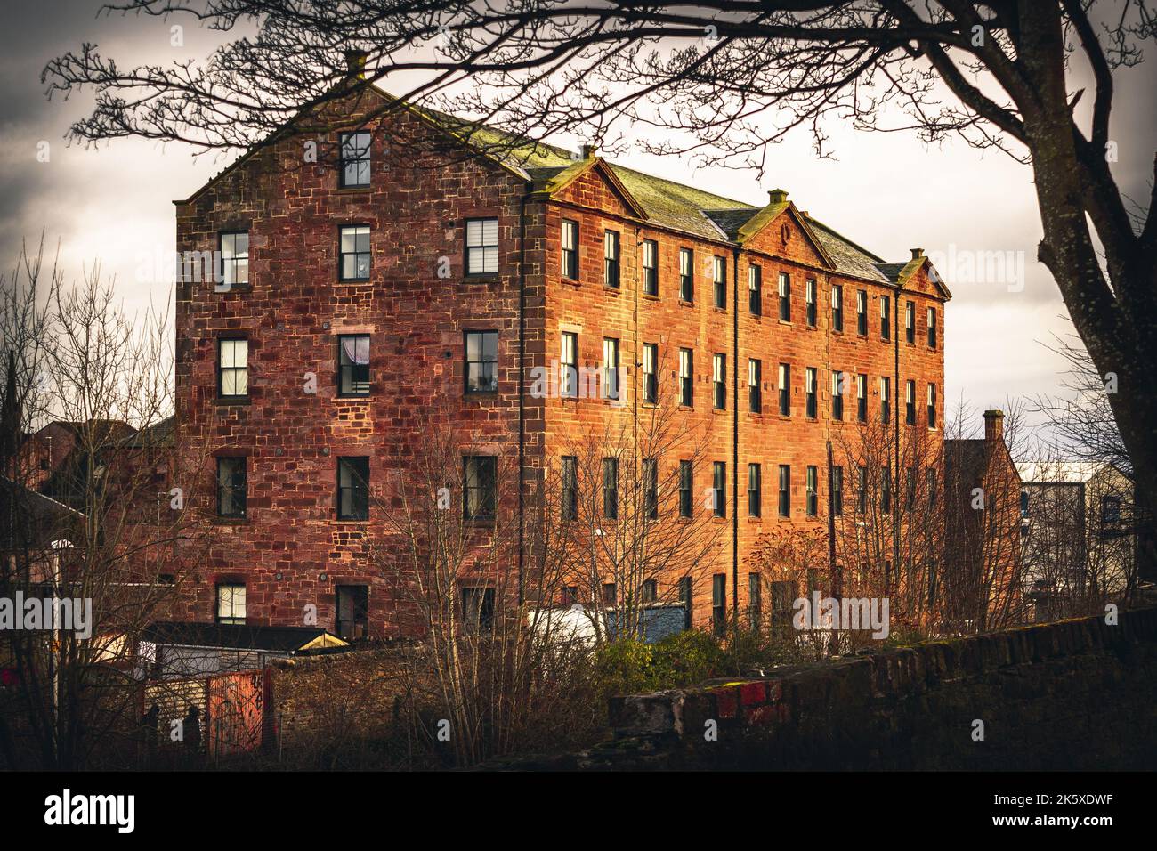 The old Arbroath mill building surrounded by leafless trees Stock Photo ...