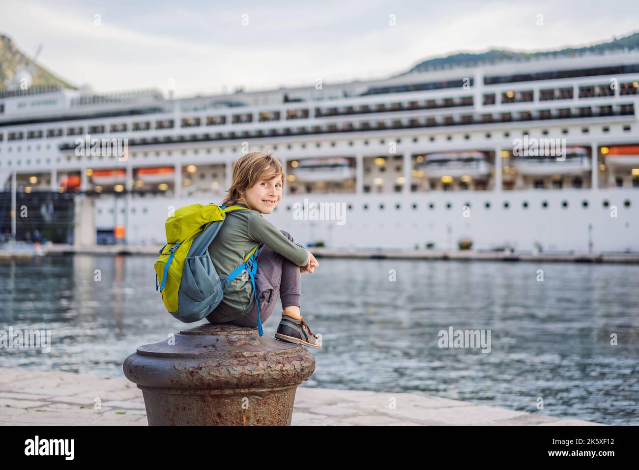 Young boy ready to travel on cruise ship Stock Photo - Alamy