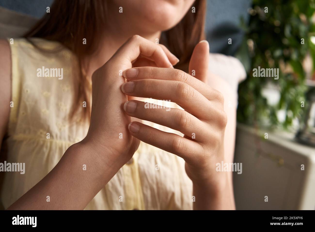 Girl practicing EFT or emotional freedom technique - tapping on the ...