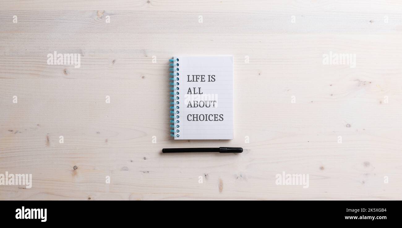 Spiral notebook with a Life is all about choices sign written in it ...