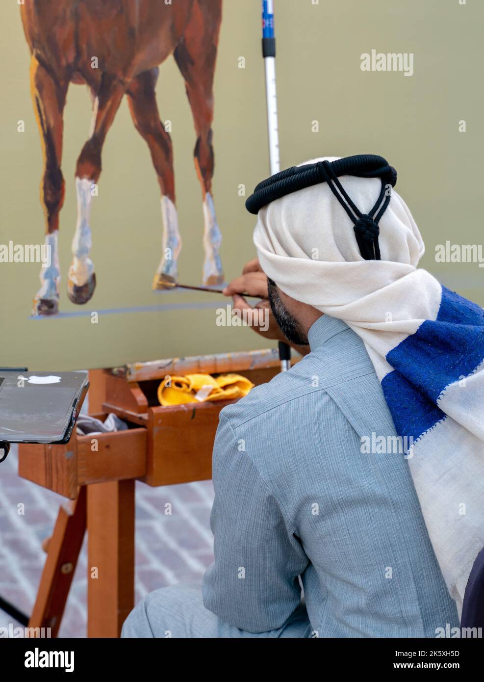 Doha,Qatar- October 01,2022 : Arab artist drawing a horse Stock Photo ...