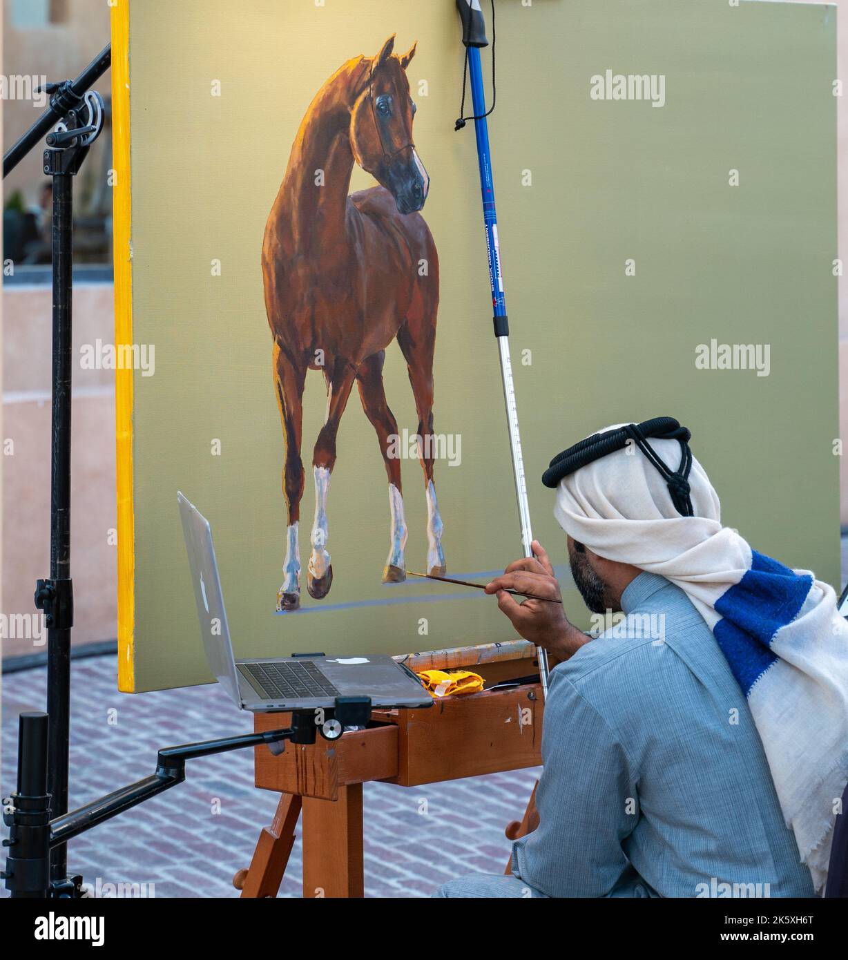 Doha,Qatar- October 01,2022 : Arab artist drawing a horse Stock Photo ...