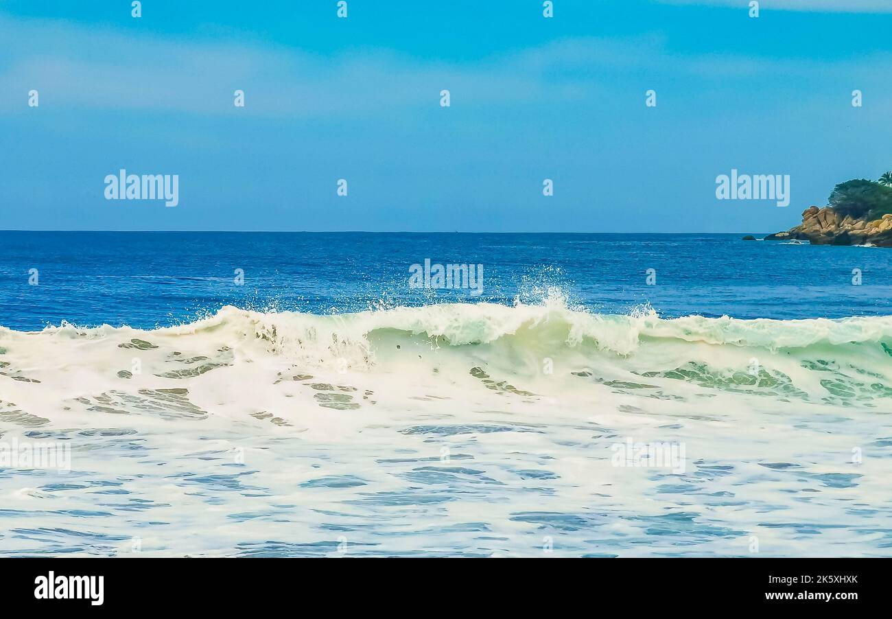 Extremely huge big surfer waves with cliffs rocks boulders stones at ...