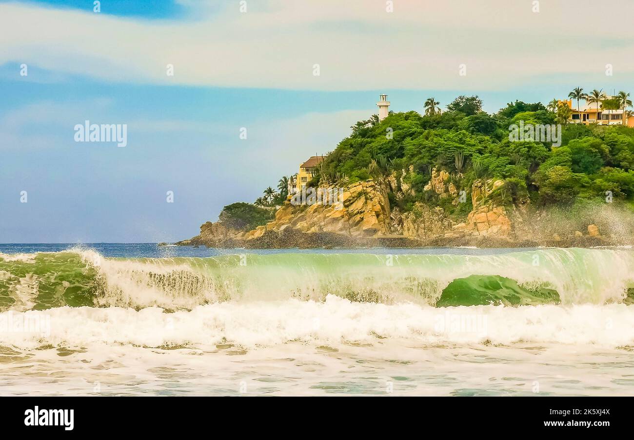 Extremely huge big surfer waves with cliffs rocks boulders stones at ...