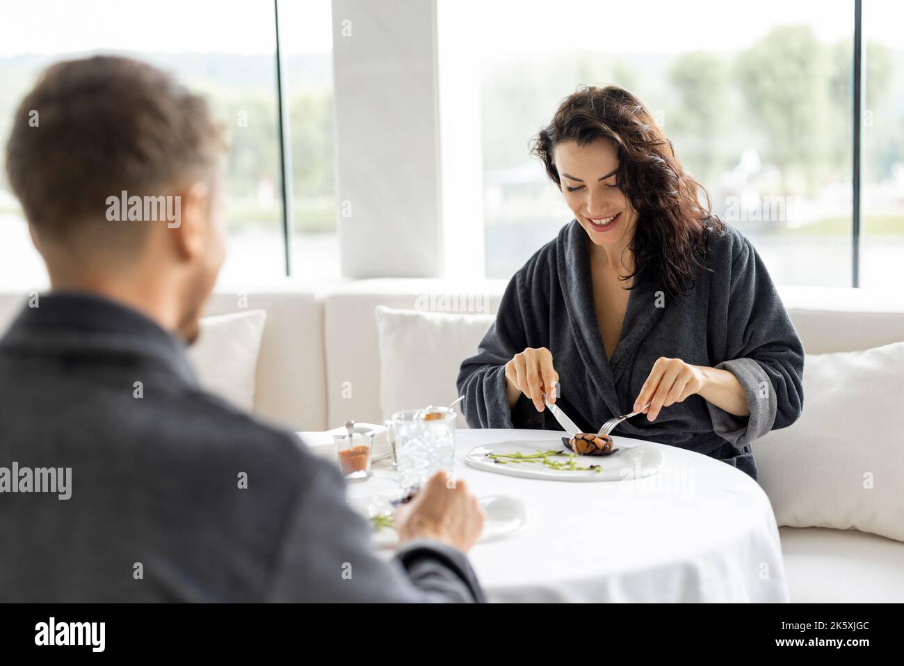 Couple eating beautiful dishes at restaurant in spa resort Stock Photo ...