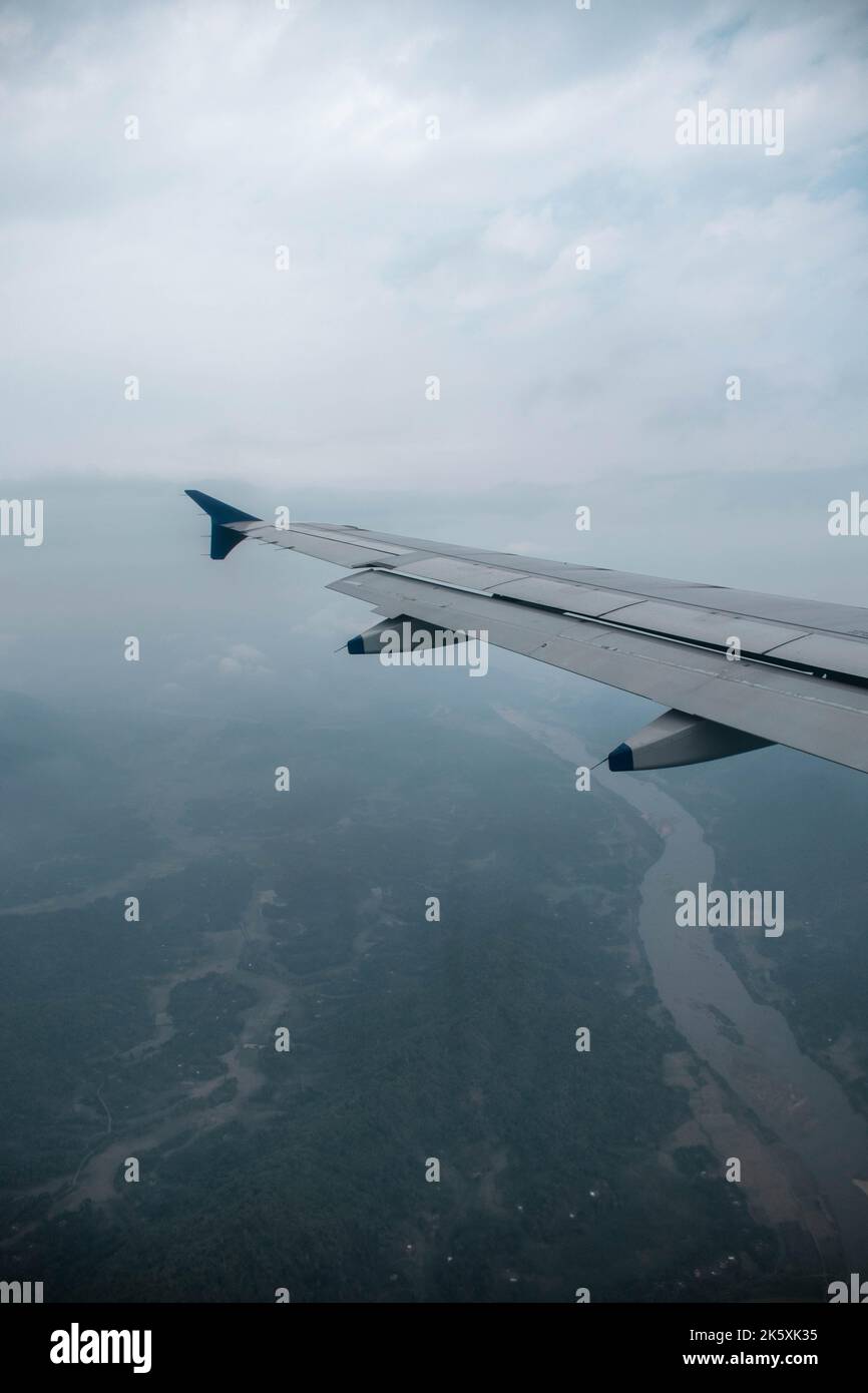 A vertical shot from the airplane window to the wing in flight Stock ...