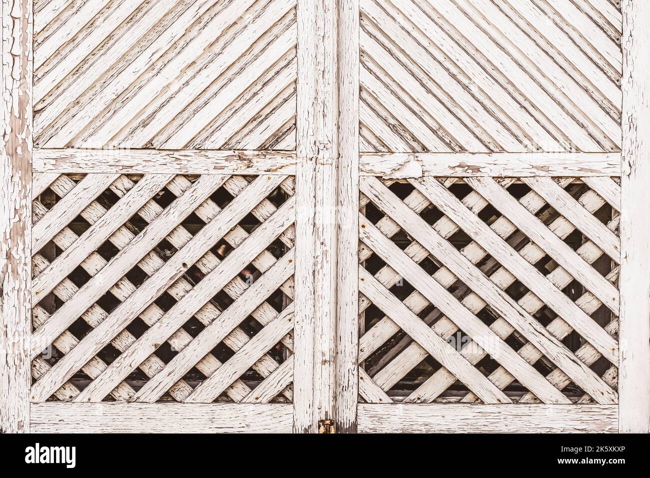 White wooden carved frame, window shutters of old village house close ...