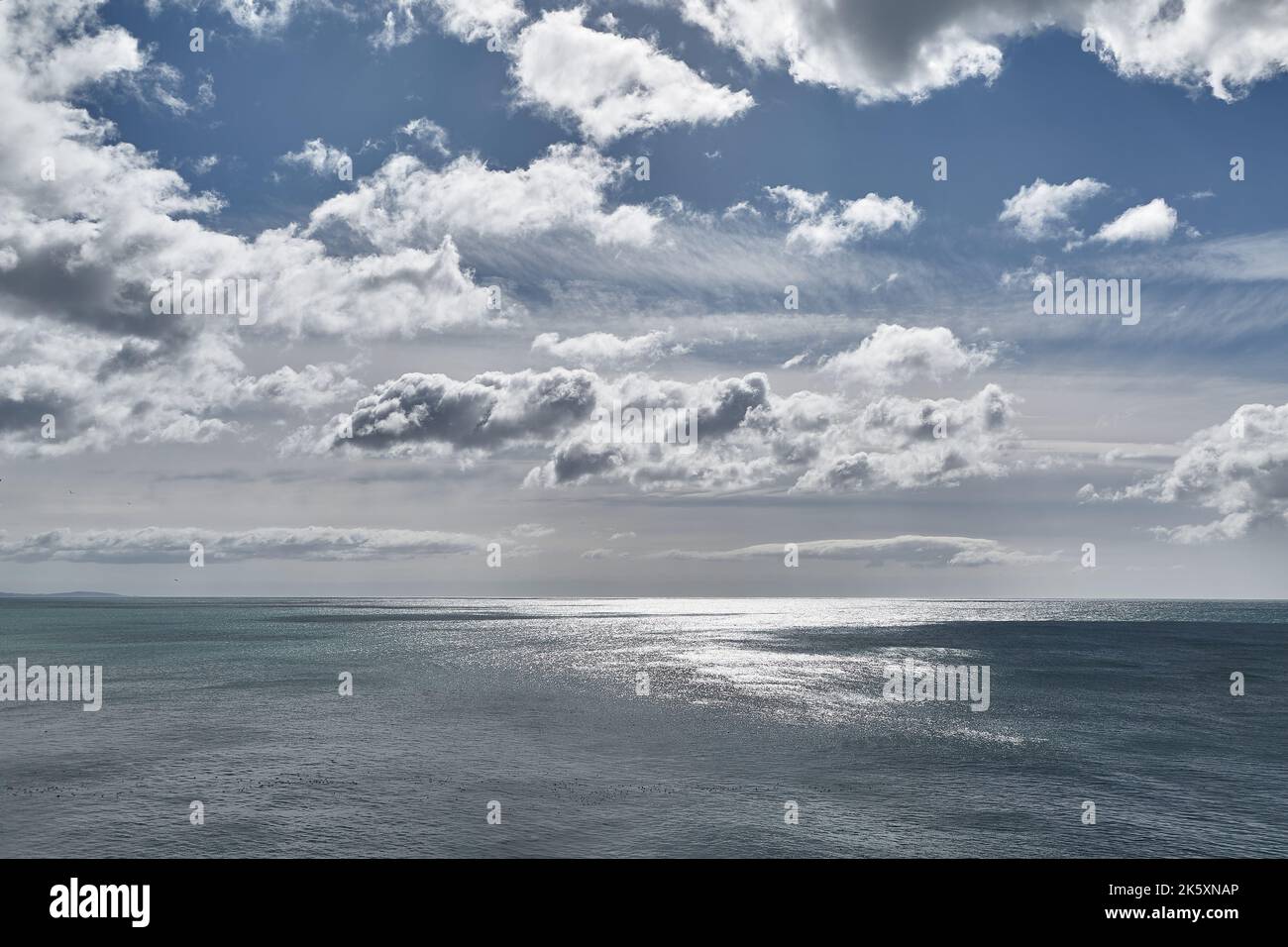 Endless sea view, bright sunlight and clouds Stock Photo - Alamy