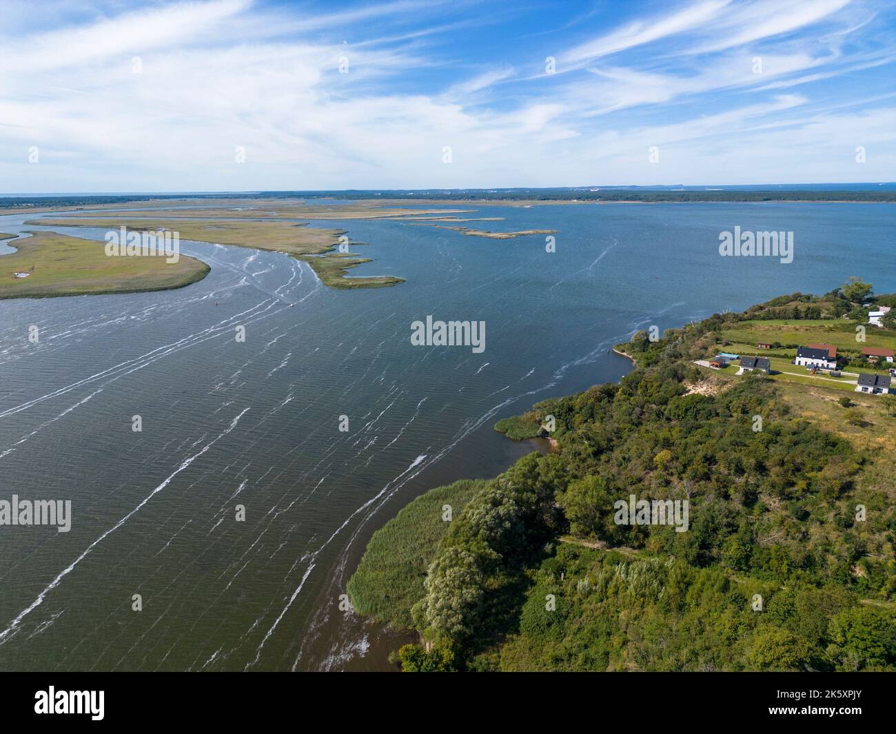 A long exposure shot of an island with beautiful ocean water under a ...