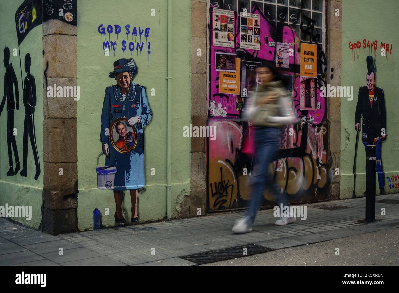 Barcelona, Spain. 10th Oct, 2022. A commuter walks past a graffiti by ...
