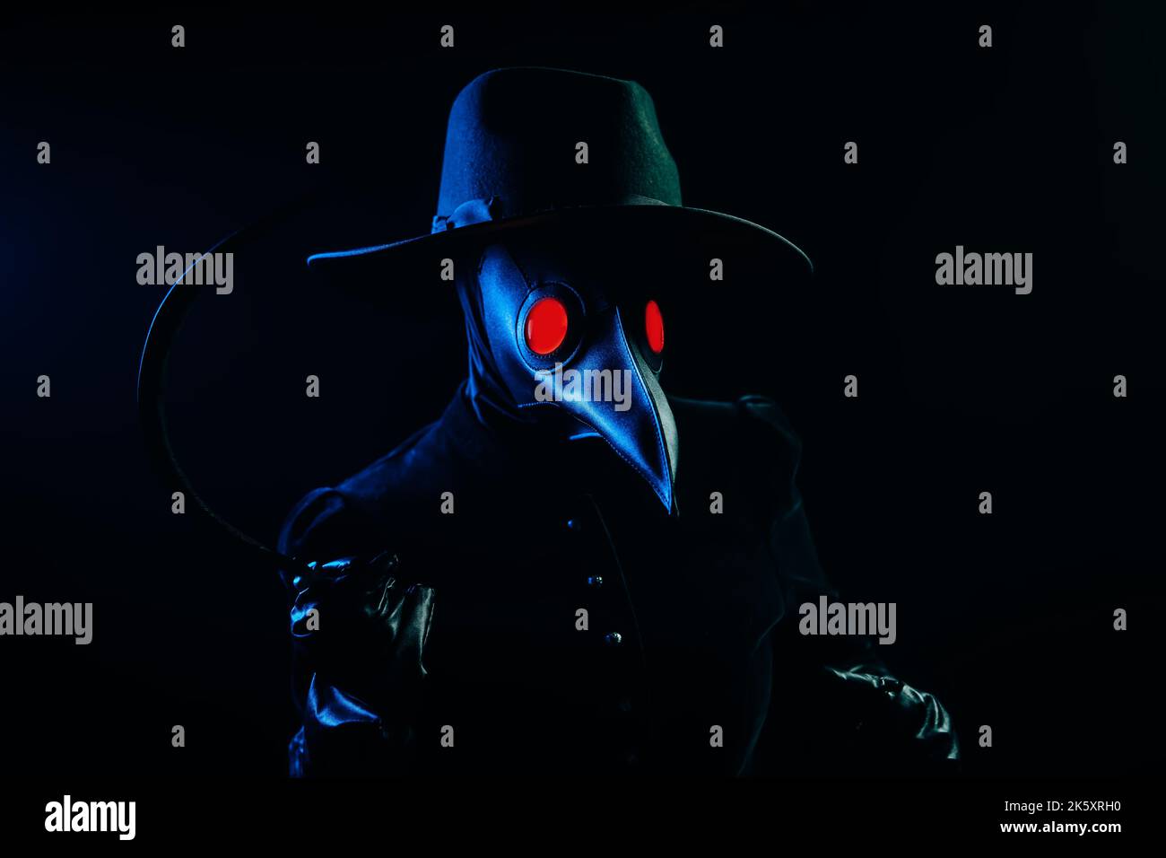 Plague doctor with sharp sickle on smoke black background. Creepy raven ...