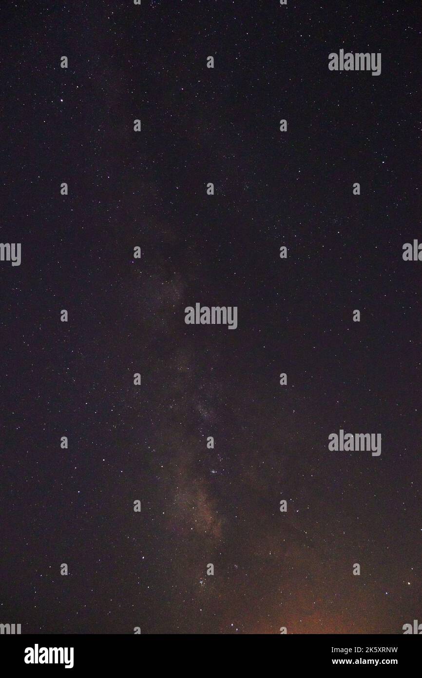 A Vertical shot of a starry night sky picturing milky way Stock Photo ...