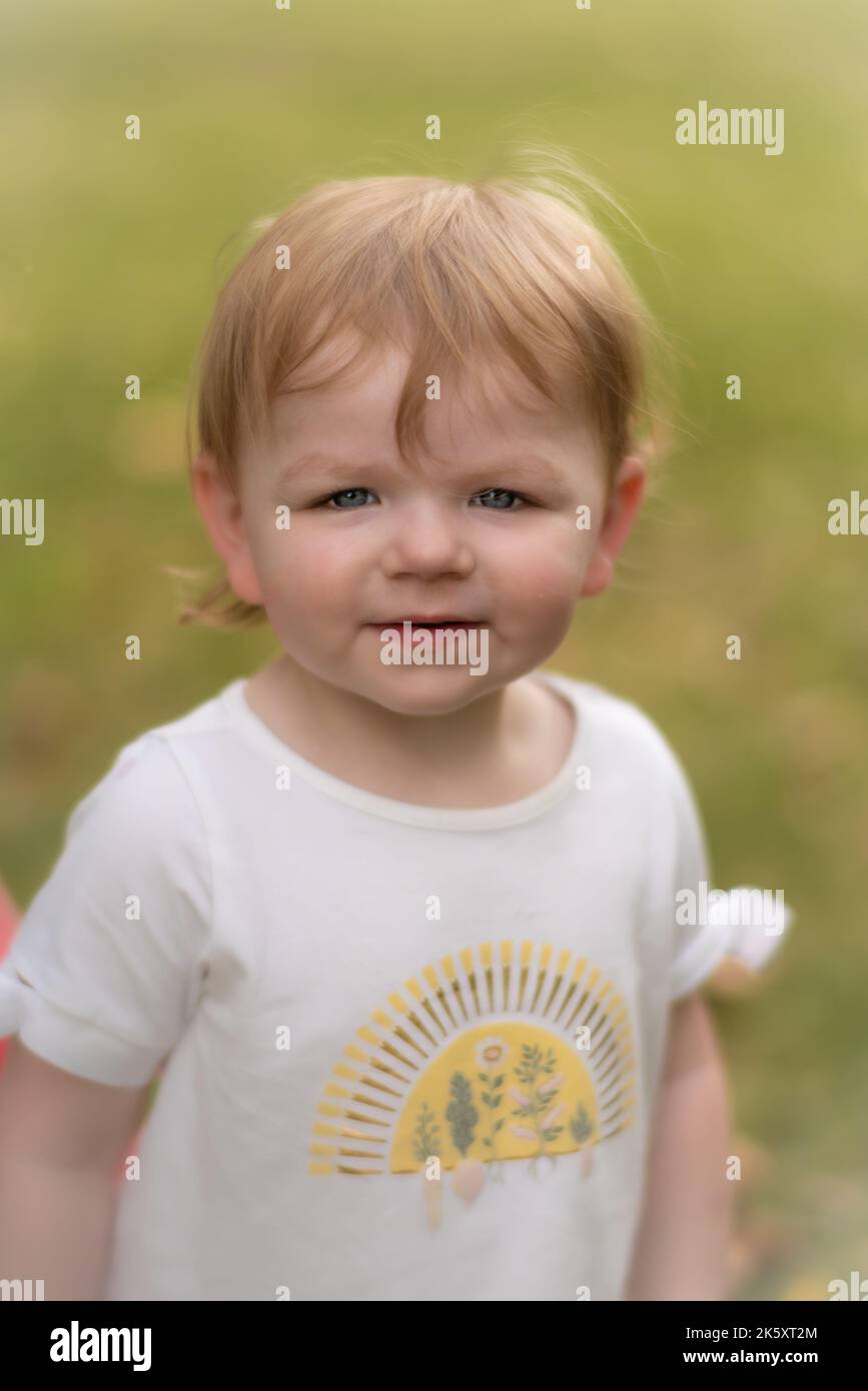 Toddler girl with blonde hair, outdoors Stock Photo - Alamy