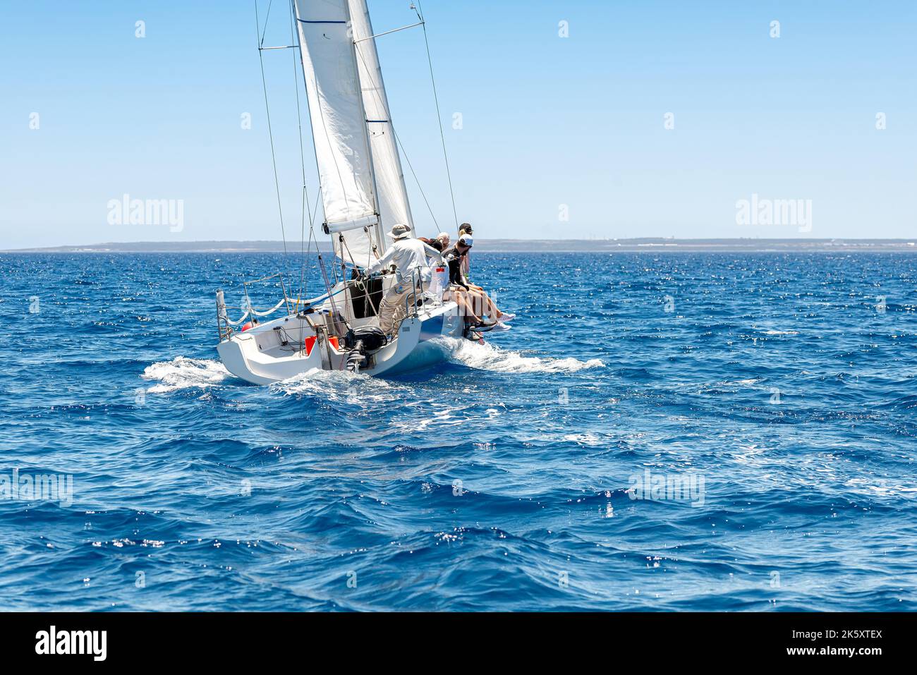 Sailing crew on sailboat during yacht regatta Stock Photo - Alamy
