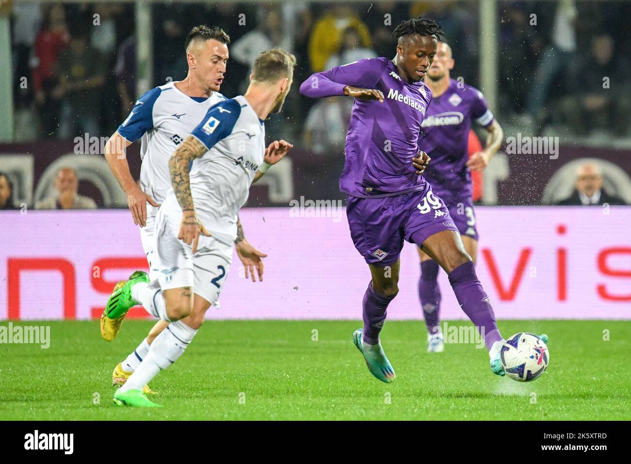 Florence, Italy. 10th Oct, 2022. Fiorentina's Christian Kouame' hampered by Lazio's Manuel ...