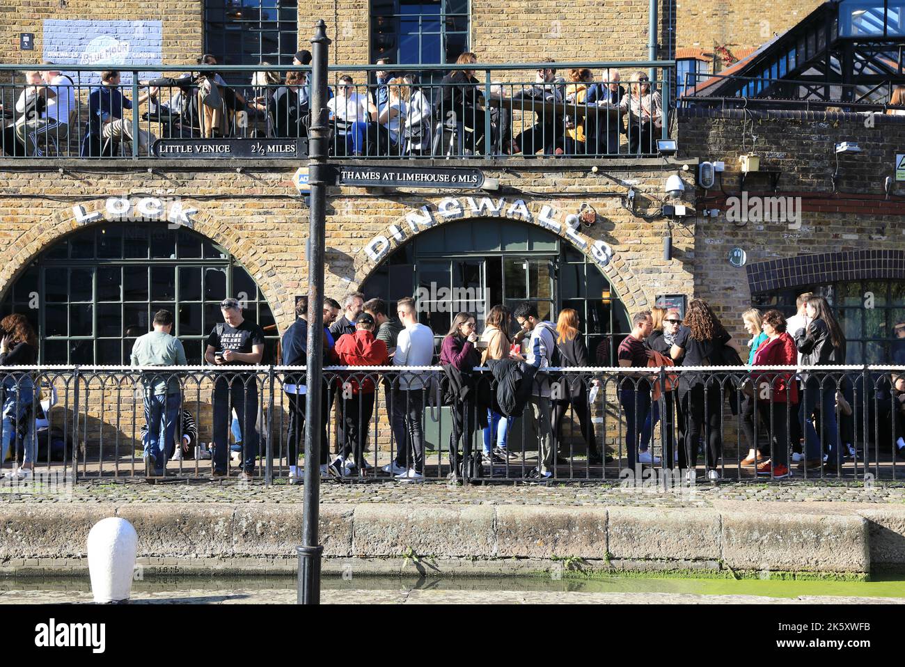 Dingwalls lively pub on Camden Lock by Regents Canal busy in warm ...