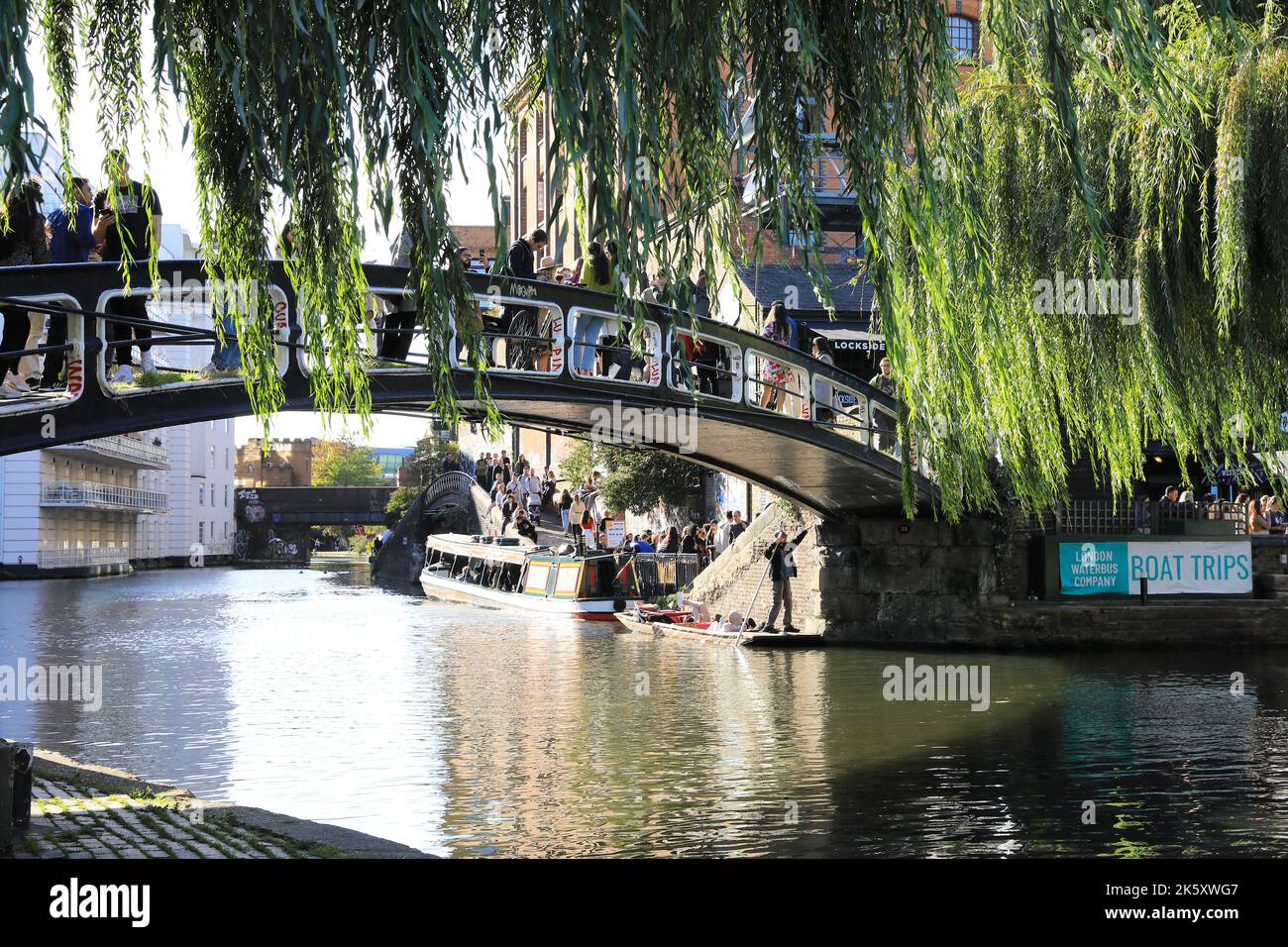 The bridge over the Regents Canal at Camden Lock, busy in autumn ...