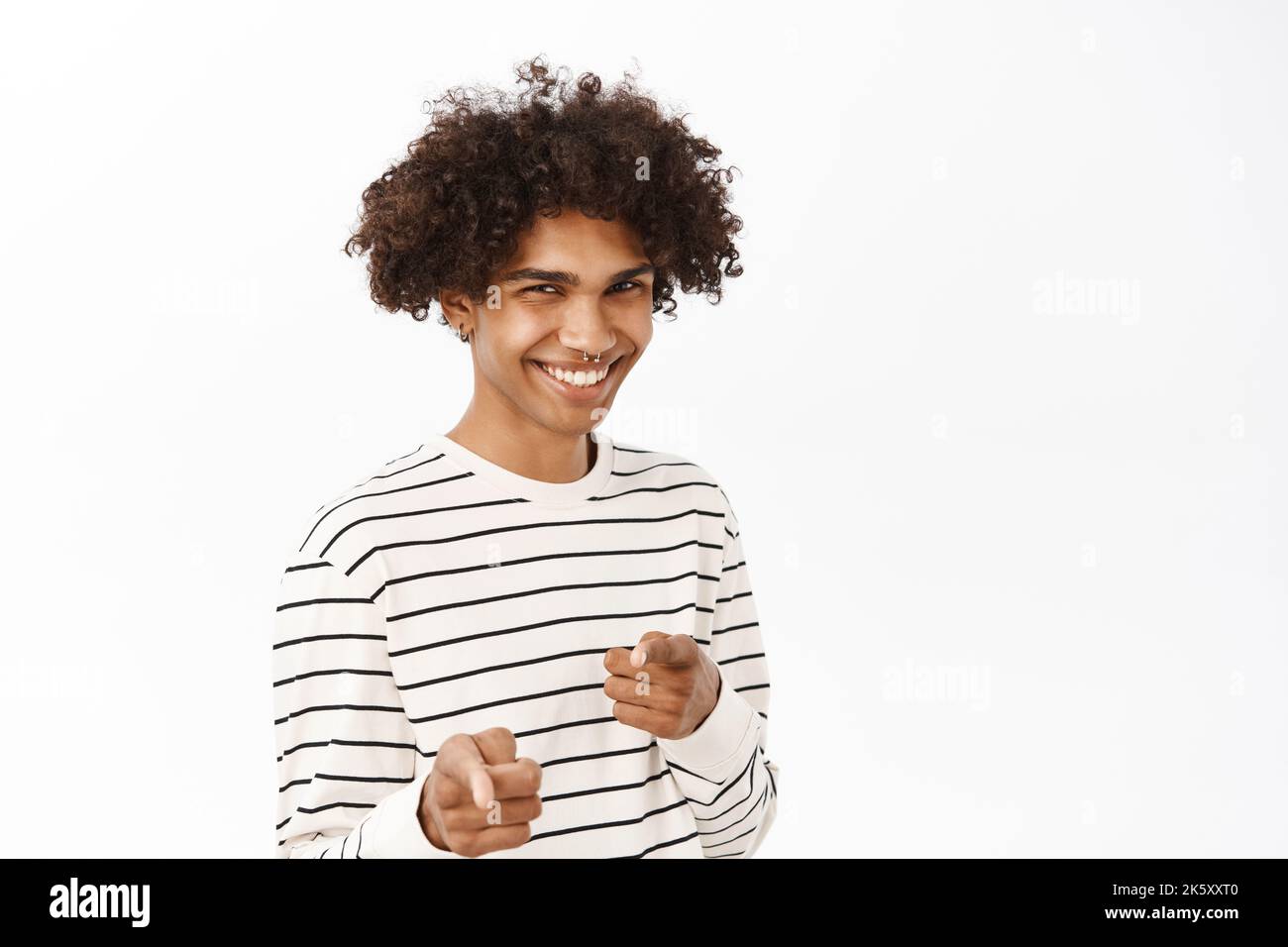 Close up portrait of handsome smiling hispanic man pointing at himself ...