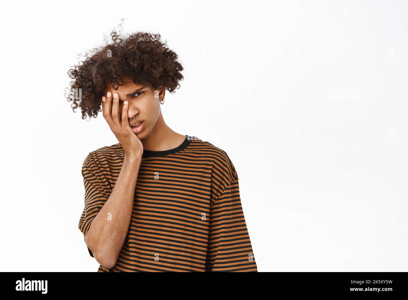 Sad and disappointed guy facepalm, grimacing with bothered, troubled ...