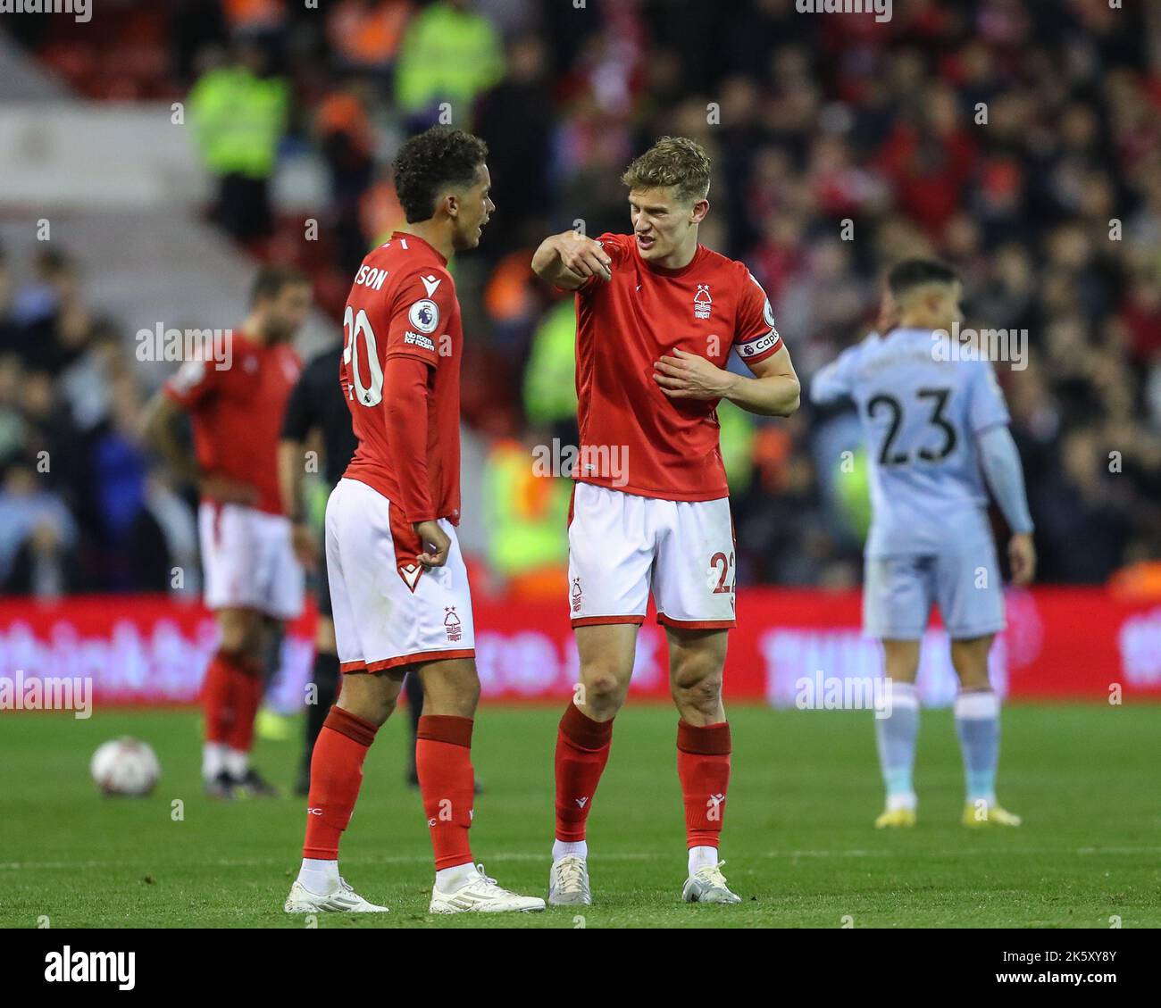Ryan Yates #22 of Nottingham Forest (R) speaks to Brennan Johnson #20 ...