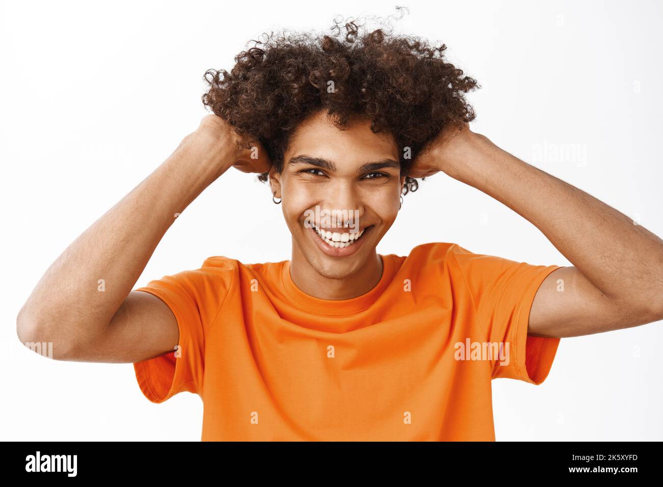 Close up of handsome hispanic boy, guy showing his curly healthy ...