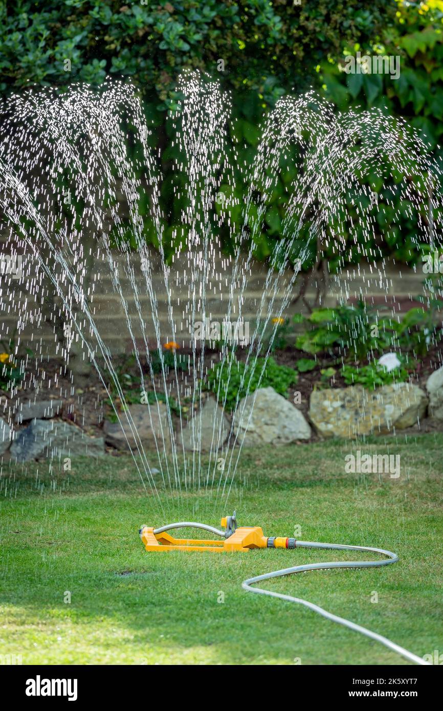 Water Spray Nozzle Machine at garden Stock Photo - Alamy