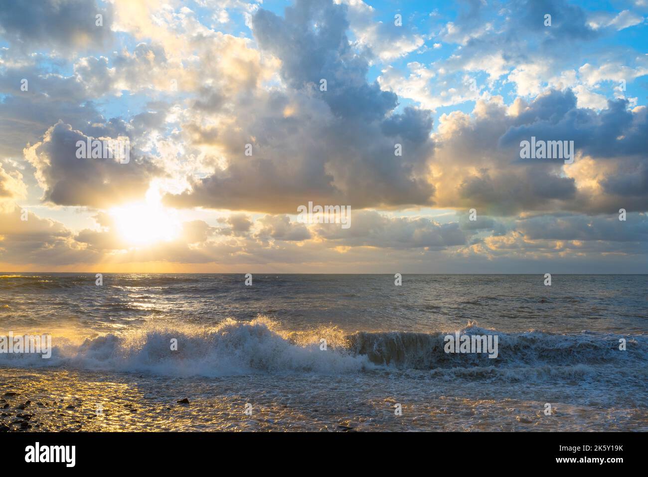 A sunset during the sea storm Stock Photo - Alamy
