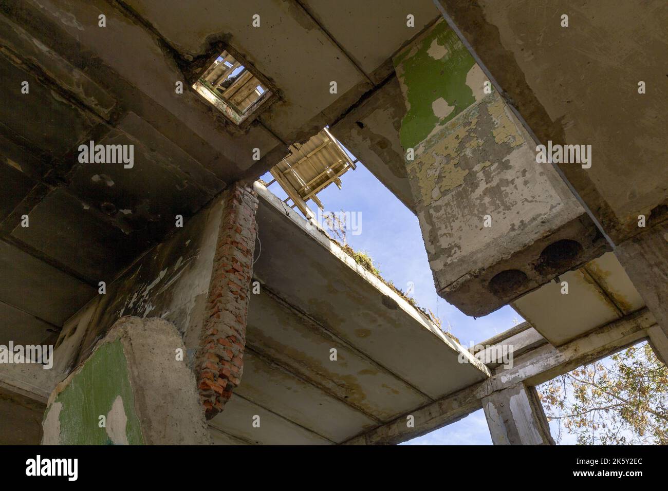 The roof destroyed after the bombing in an industrial building Stock ...