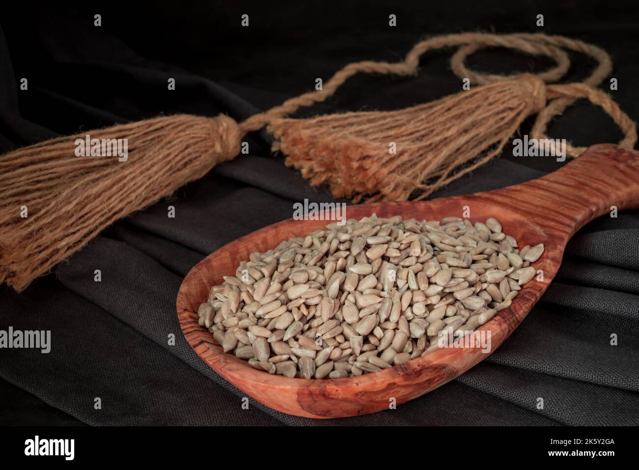 dried grains seeds on a wooden spoon Stock Photo - Alamy