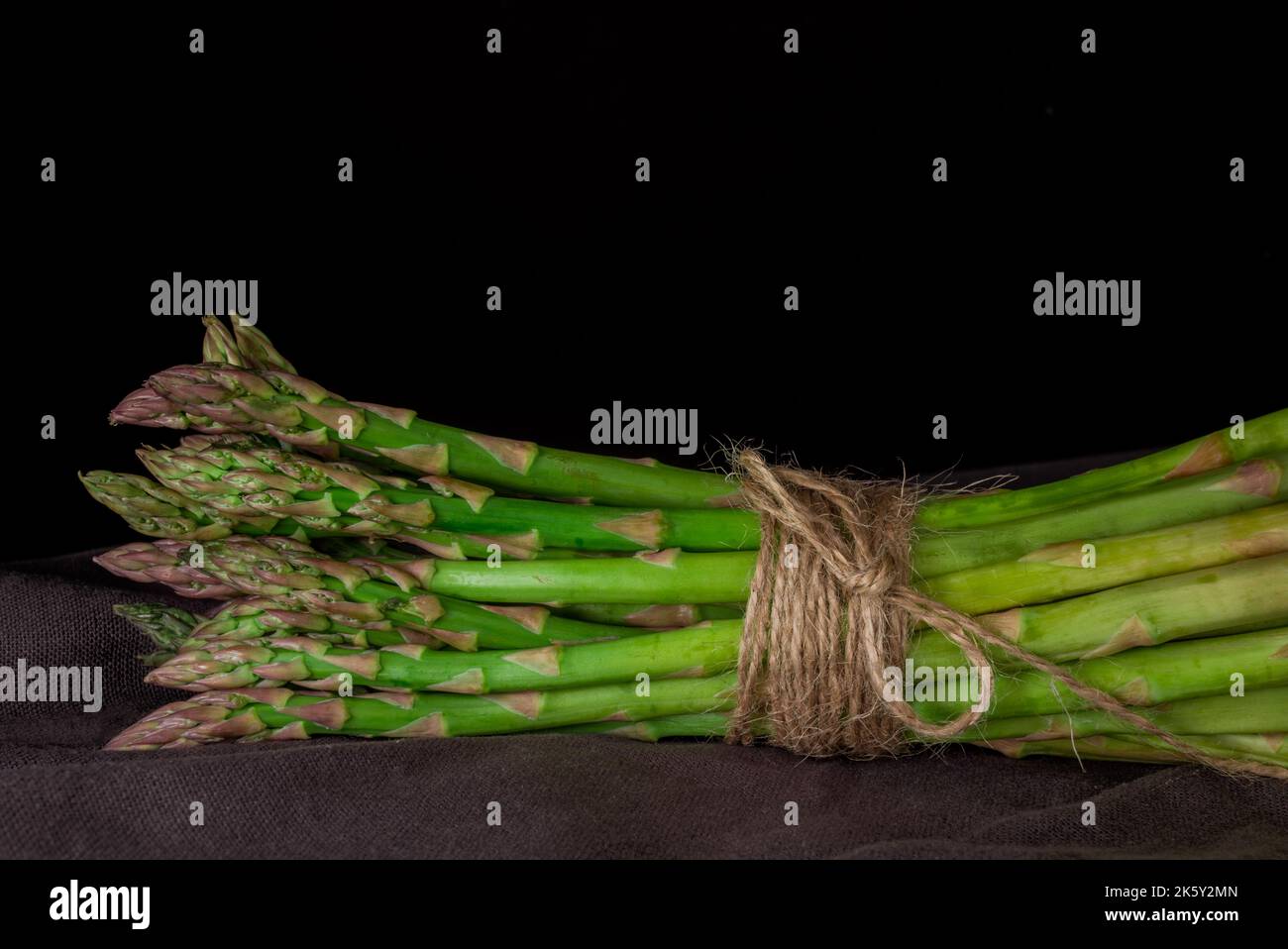 Fresh asparagus on table close up horizontal Stock Photo - Alamy