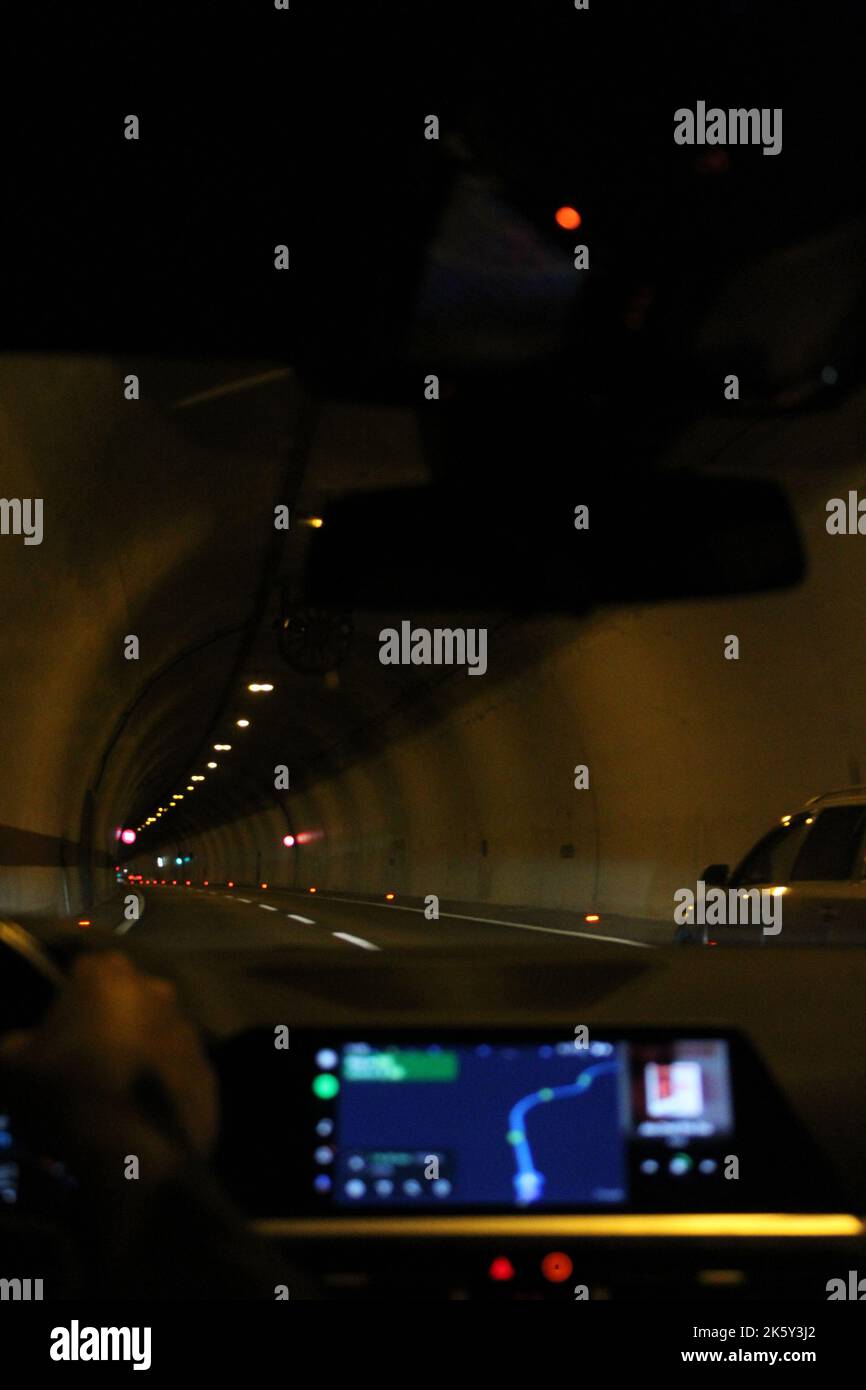 A vertical closeup shot of the inside of a tunnel from inside of a car ...