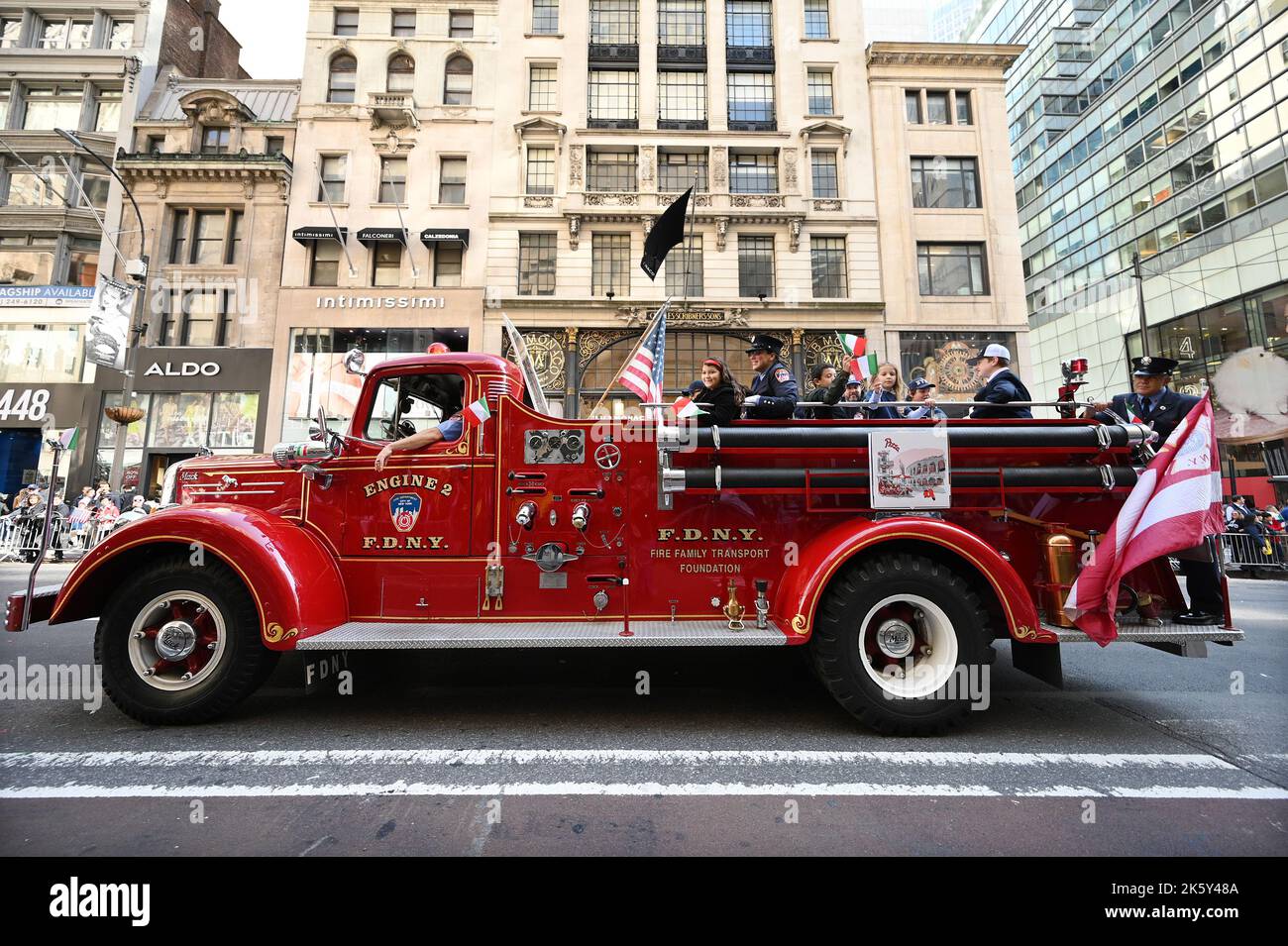 New York, NY, October 10, 2022, A group of parade-goers ride in a ...