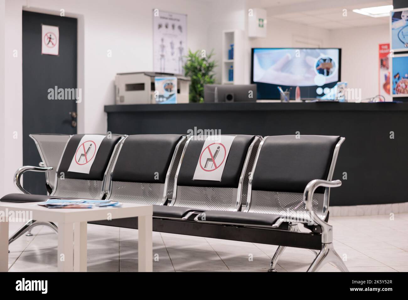 Prevention posters marking waiting chairs to avoid covid infection ...