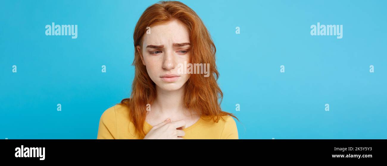 Headshot Portrait of tender redhead teenage girl with serious ...