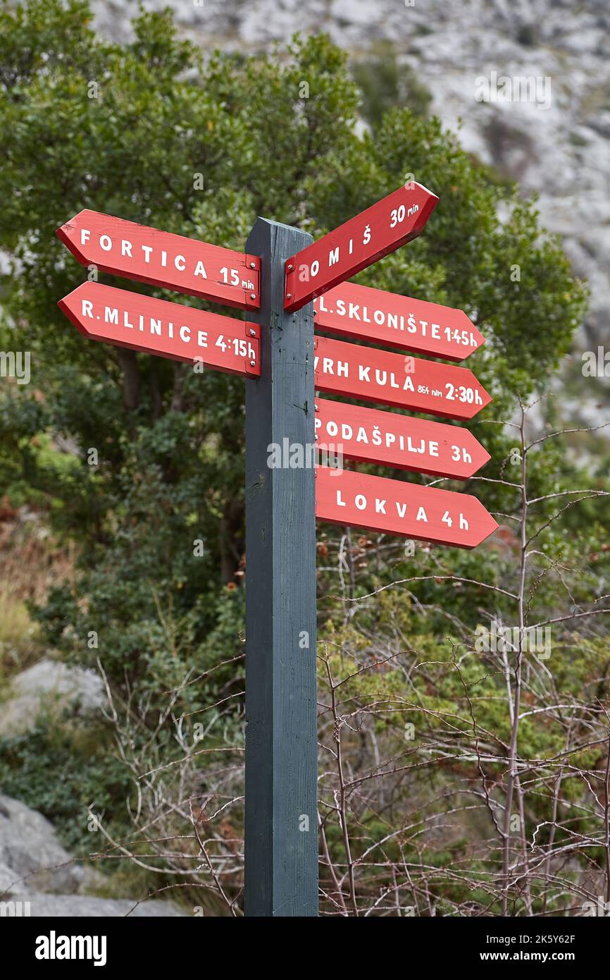 Direction signs on a trail in Croatia Stock Photo - Alamy