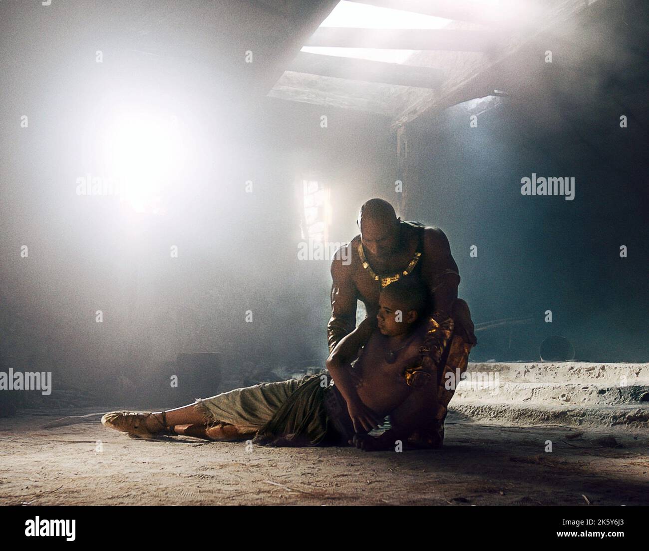 BLACK ADAM, from top: Dwayne Johnson as Black Adam, Jalon Christian as ...