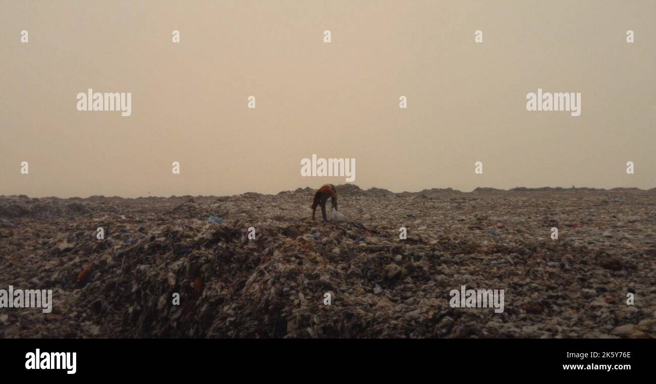 INVISIBLE DEMONS, (aka INVISIBLE DEMONS TUHON MERKIT), a person sifts ...