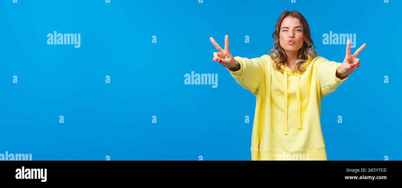 Lovely silly good-looking teenage girl send positive vibe, show peace ...